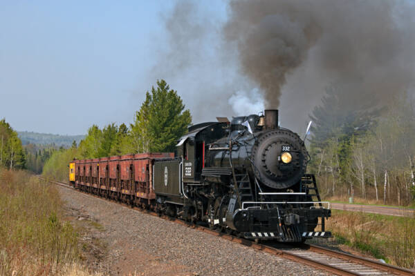Scene from the past: steam locomotive moves ore cars donated by ...